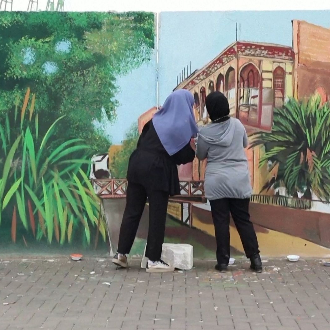 Iraqis adorn streets with murals ahead of Arabian Gulf Cup