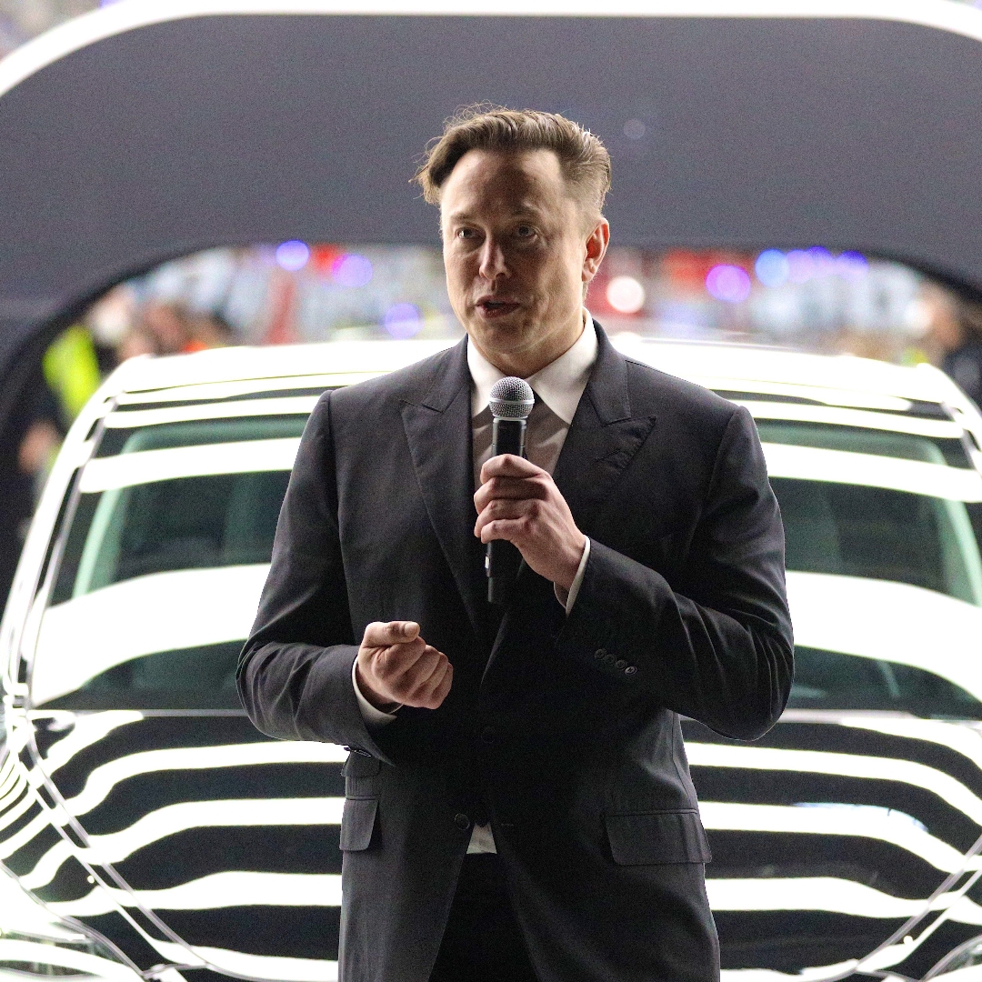 Watch Elon Musk dance as he hands over new German-made Teslas