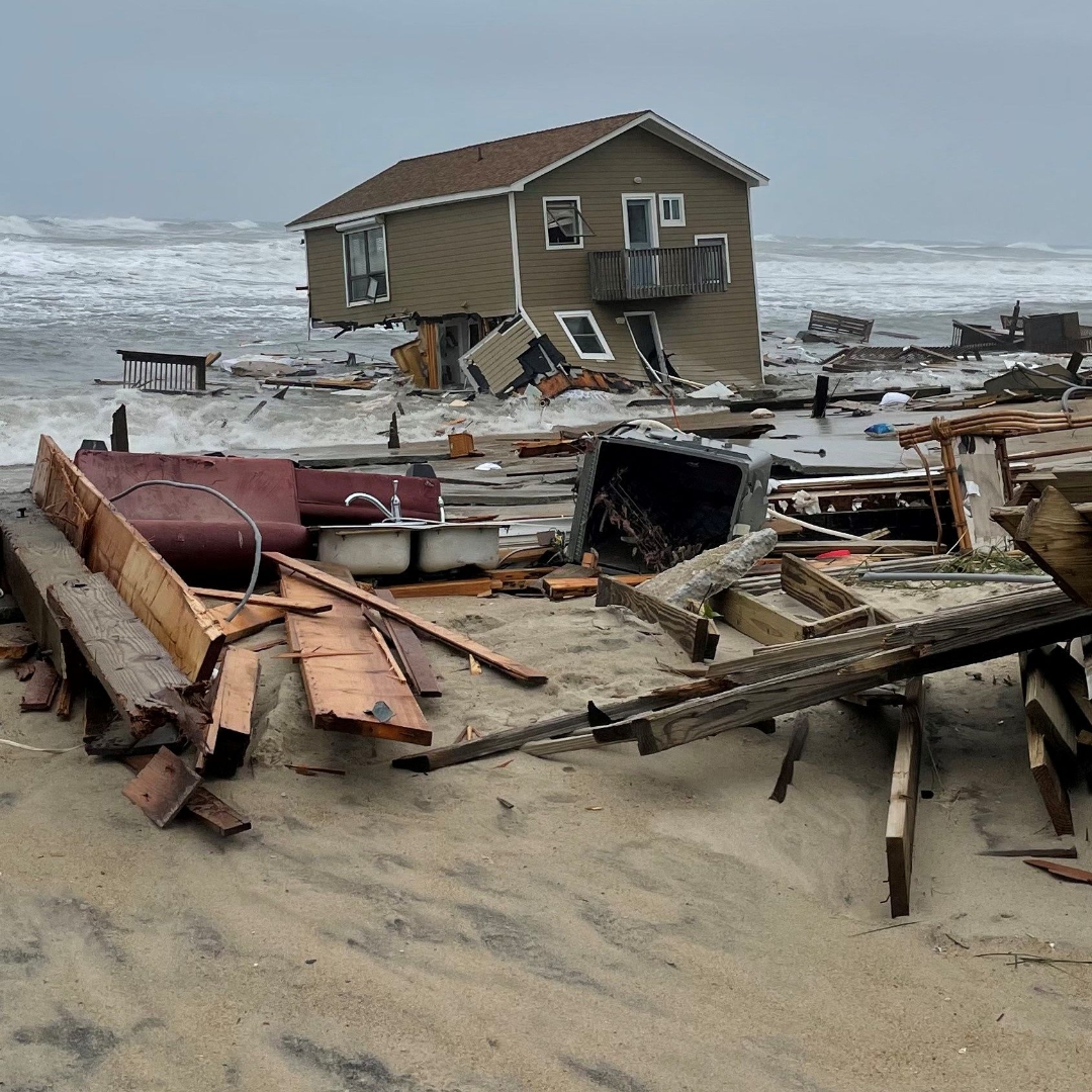 Watch as beach house collapses into waves