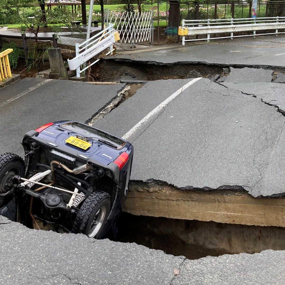 Japan floods cause roads and bridges to collapse