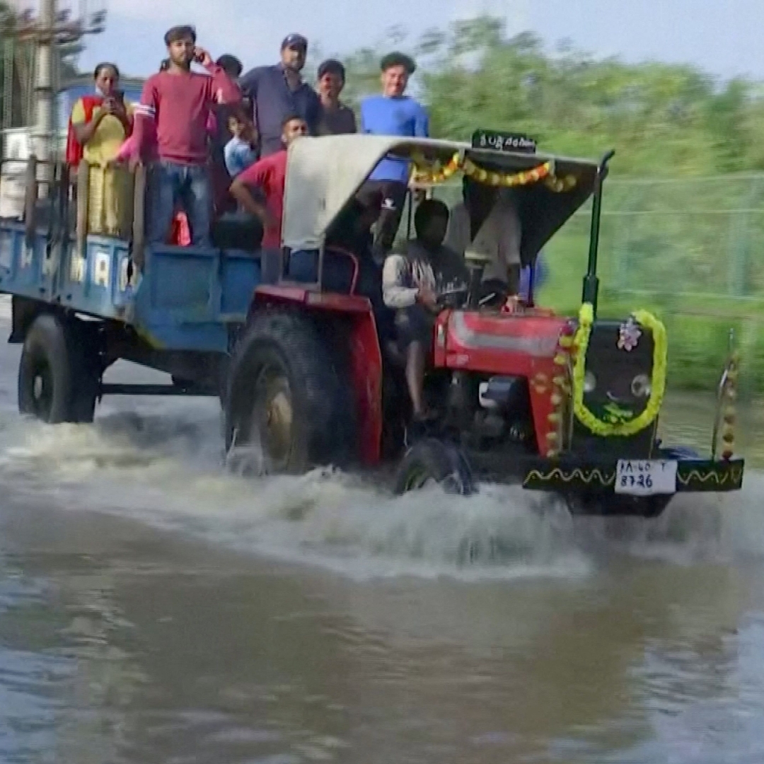 People commute in tractors as floods hit India’s Bengaluru city