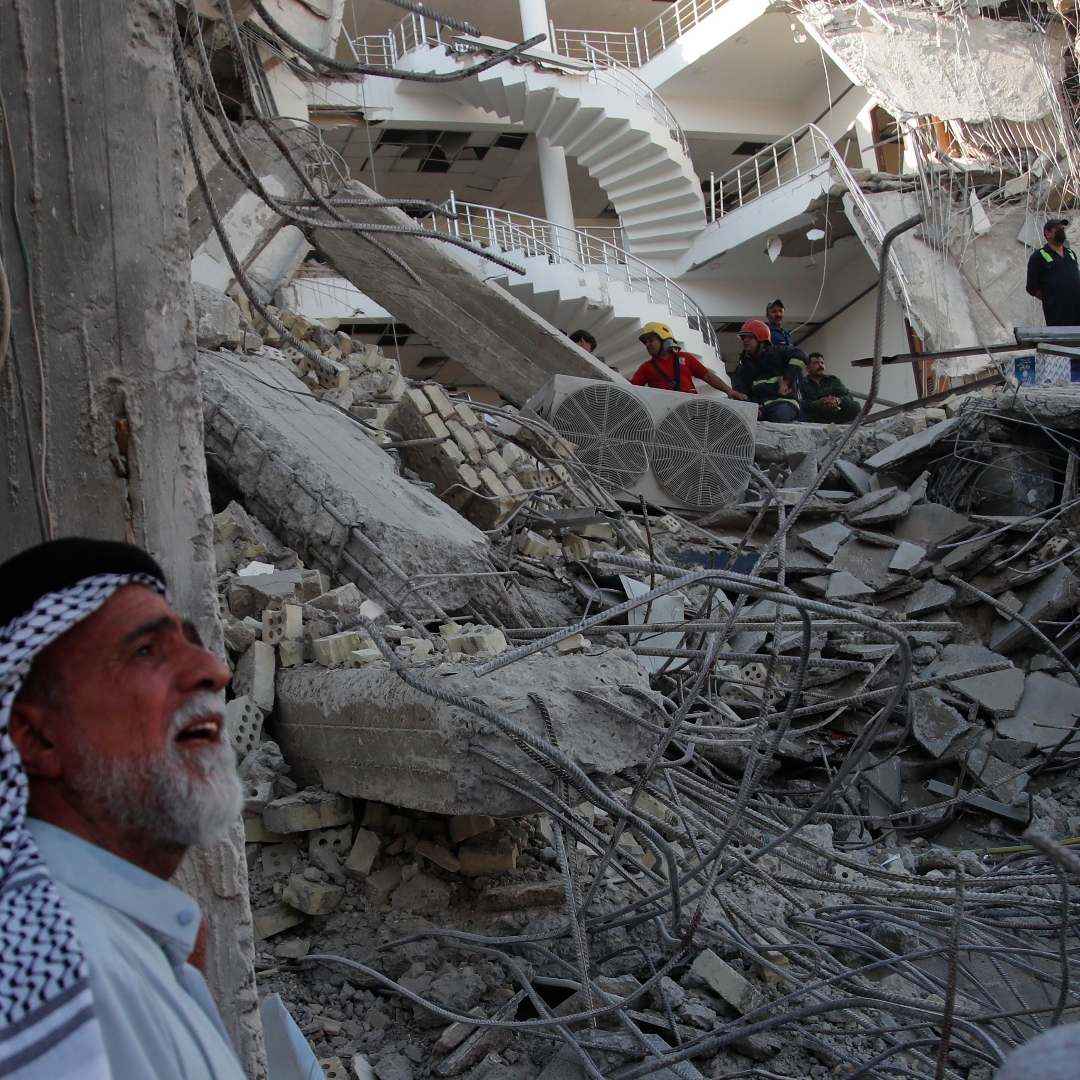 At least one dead and three trapped in Iraq building collapse