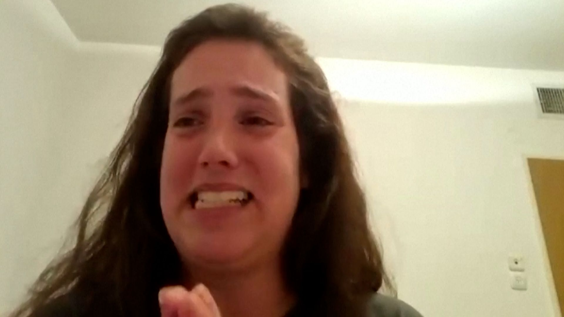 Israeli woman awaits news of six missing family members