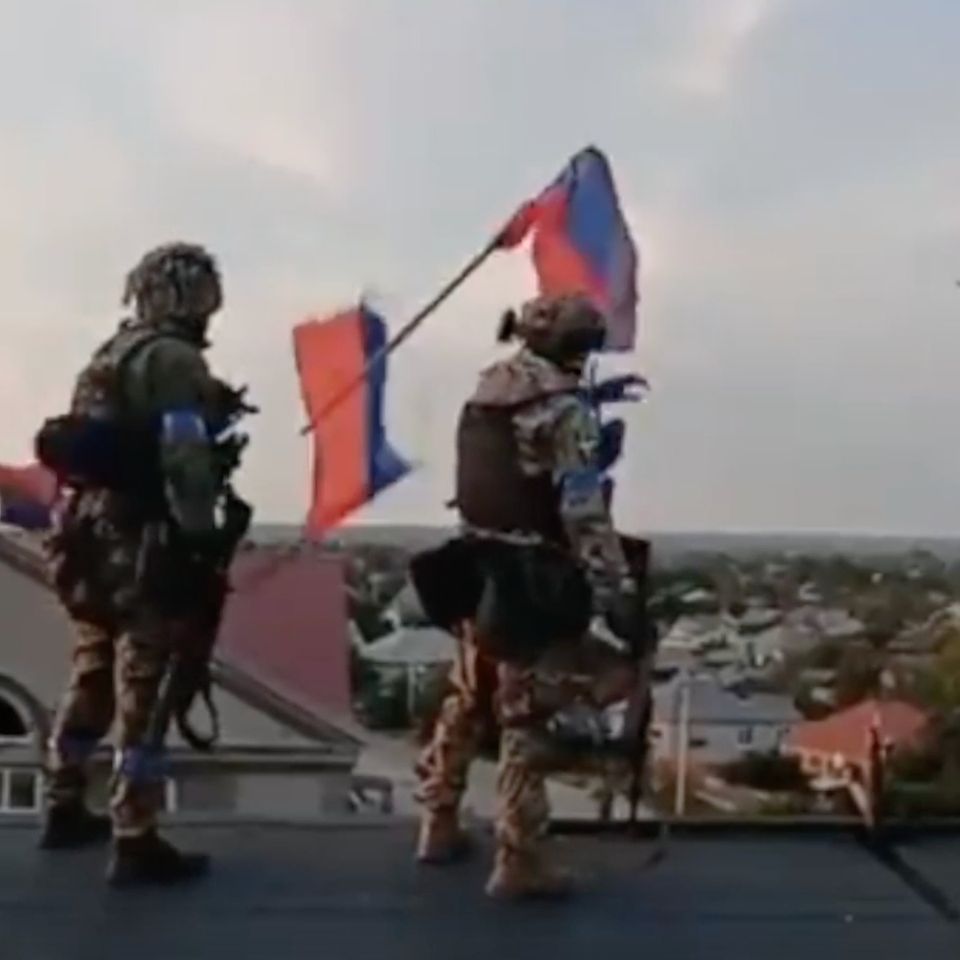 Military footage shows Ukraine soldiers dismantling Russian flags in a ...